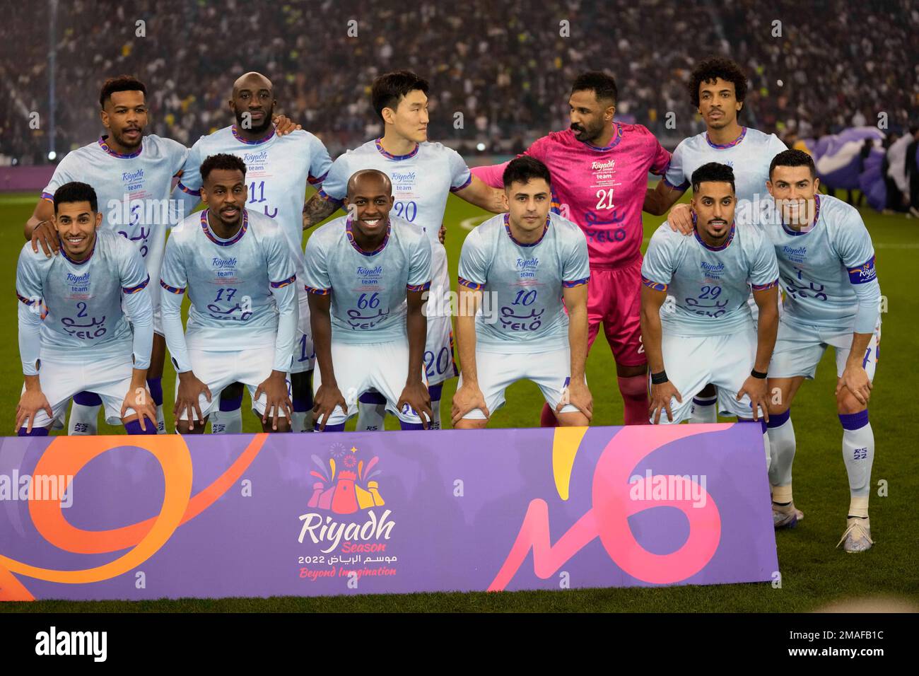 Cristiano Ronaldo, right, poses with a combined XI of Saudi Arabian ...