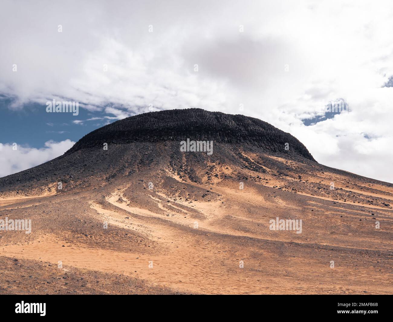 A volcanic hill in the Black Desert, Egypt Stock Photo - Alamy