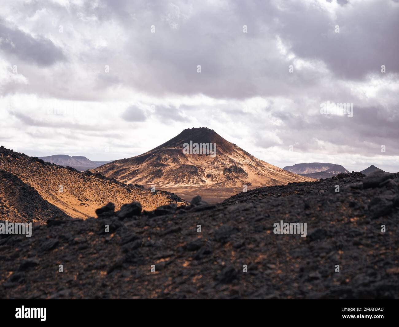 A volcanic hill in the Black Desert, Egypt Stock Photo - Alamy