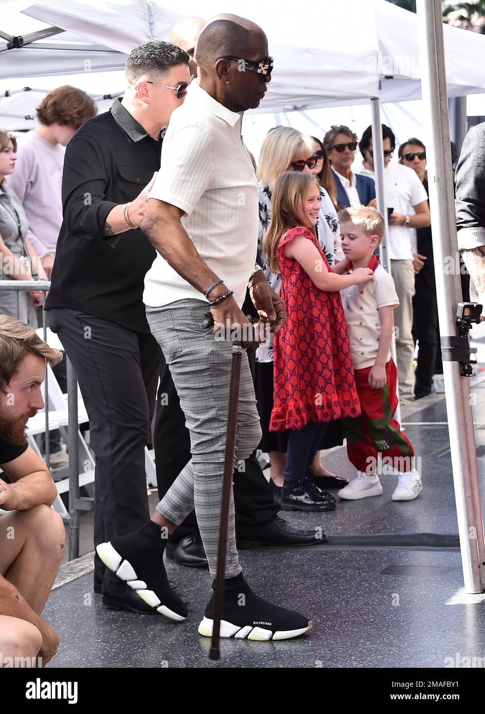 Former "American Idol" judge Randy Jackson walks with a cane as he attends a ceremony honoring ...