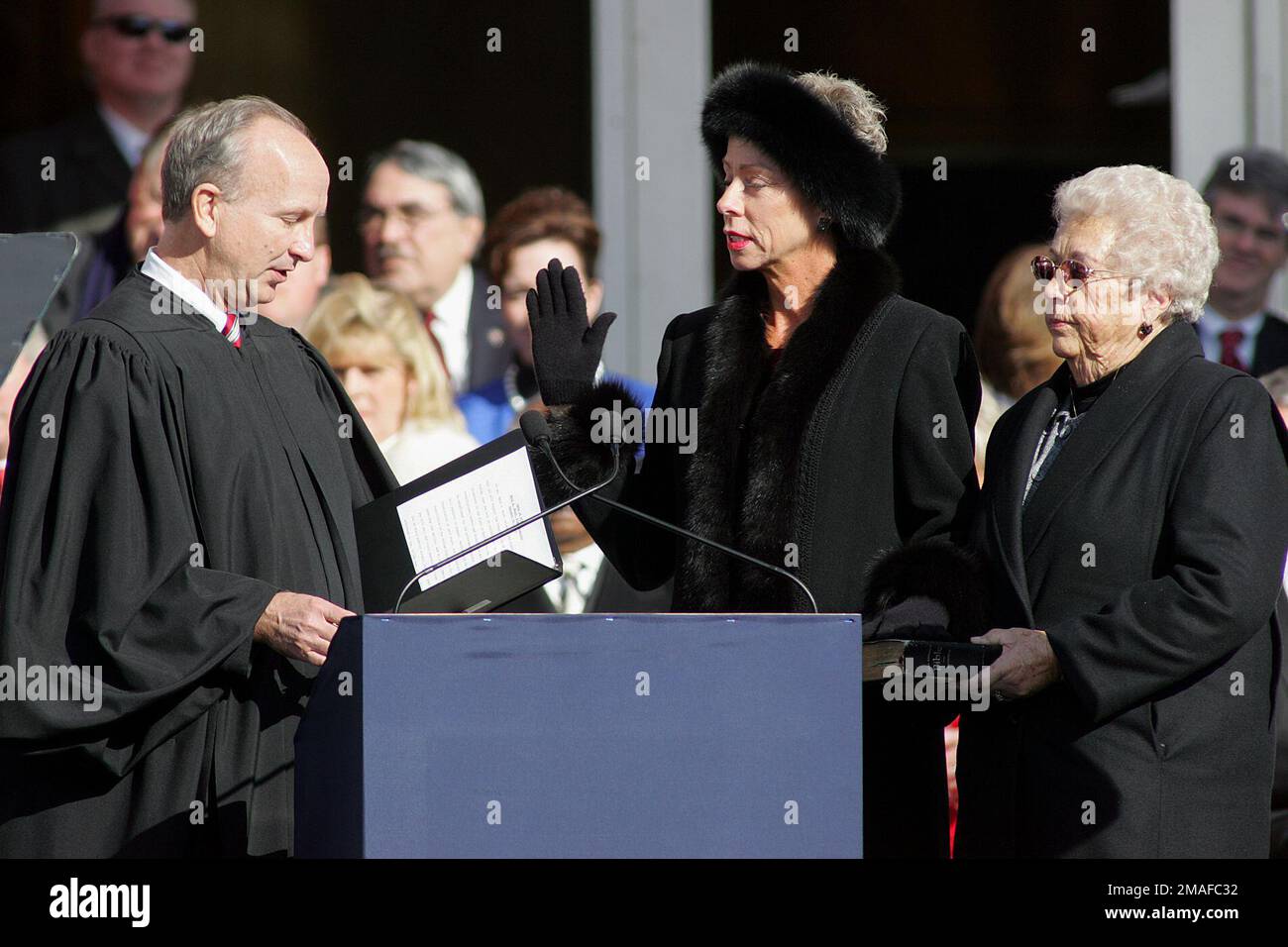 FILE - North Carolina State Auditor Beth Wood, center, is sworn into ...