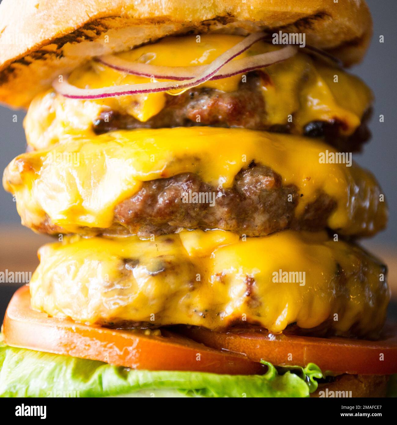 Triple cheeseburger hi-res stock photography and images - Alamy