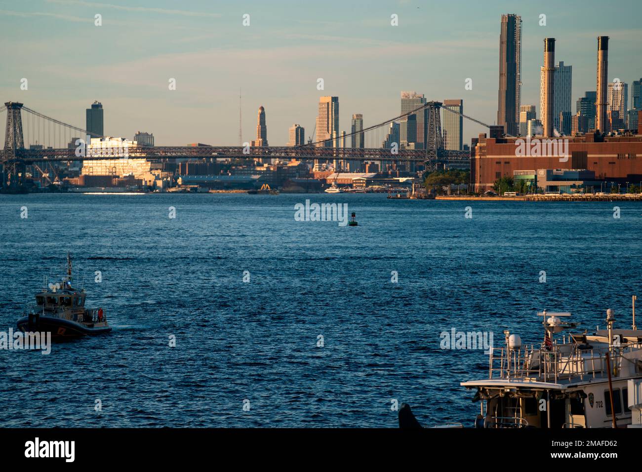 NYPD and Coast Guard boats patrol the East River outside the United ...