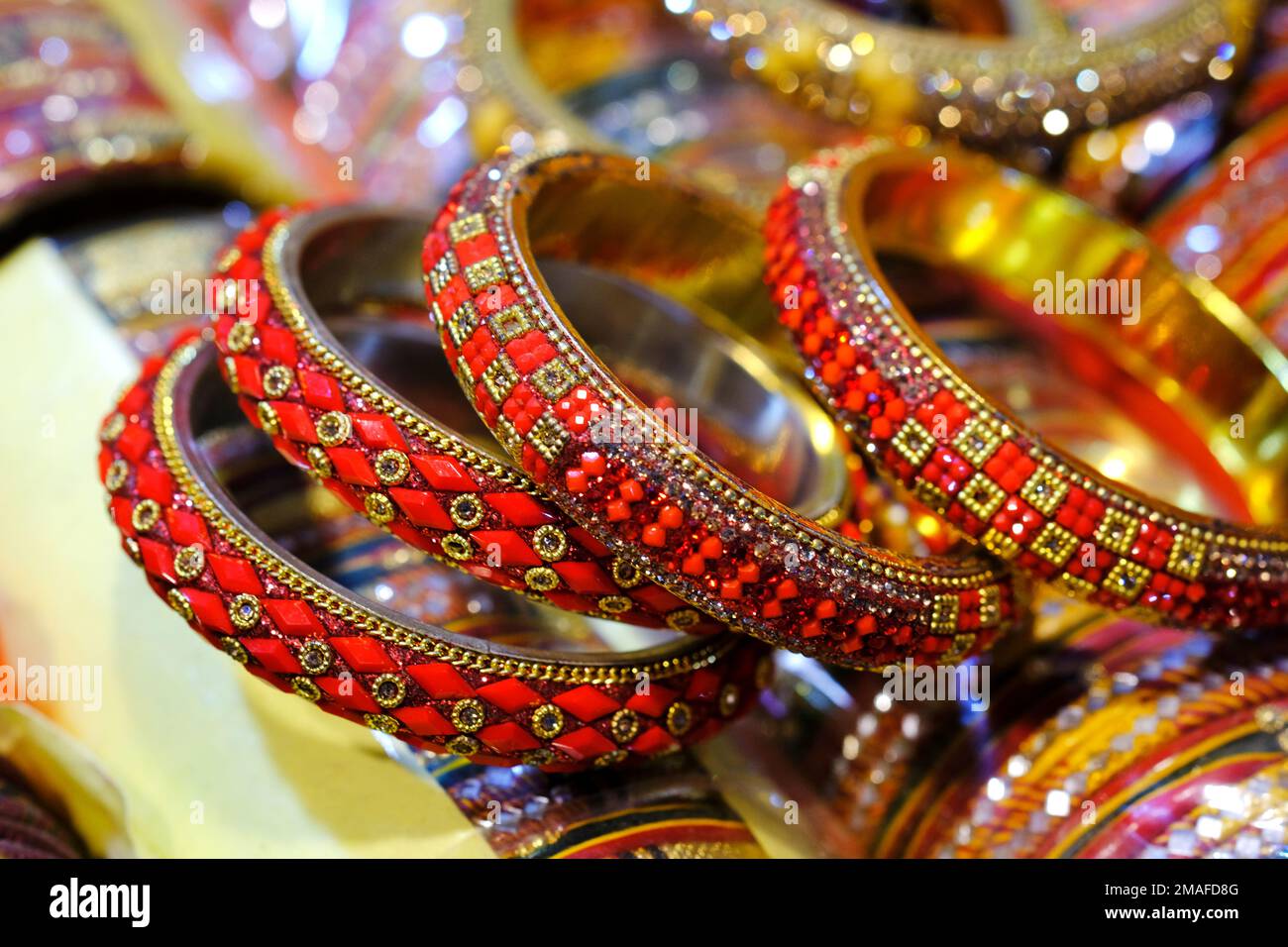 Indian Gold bangles displayed in local shop in a market of Pune, India ...