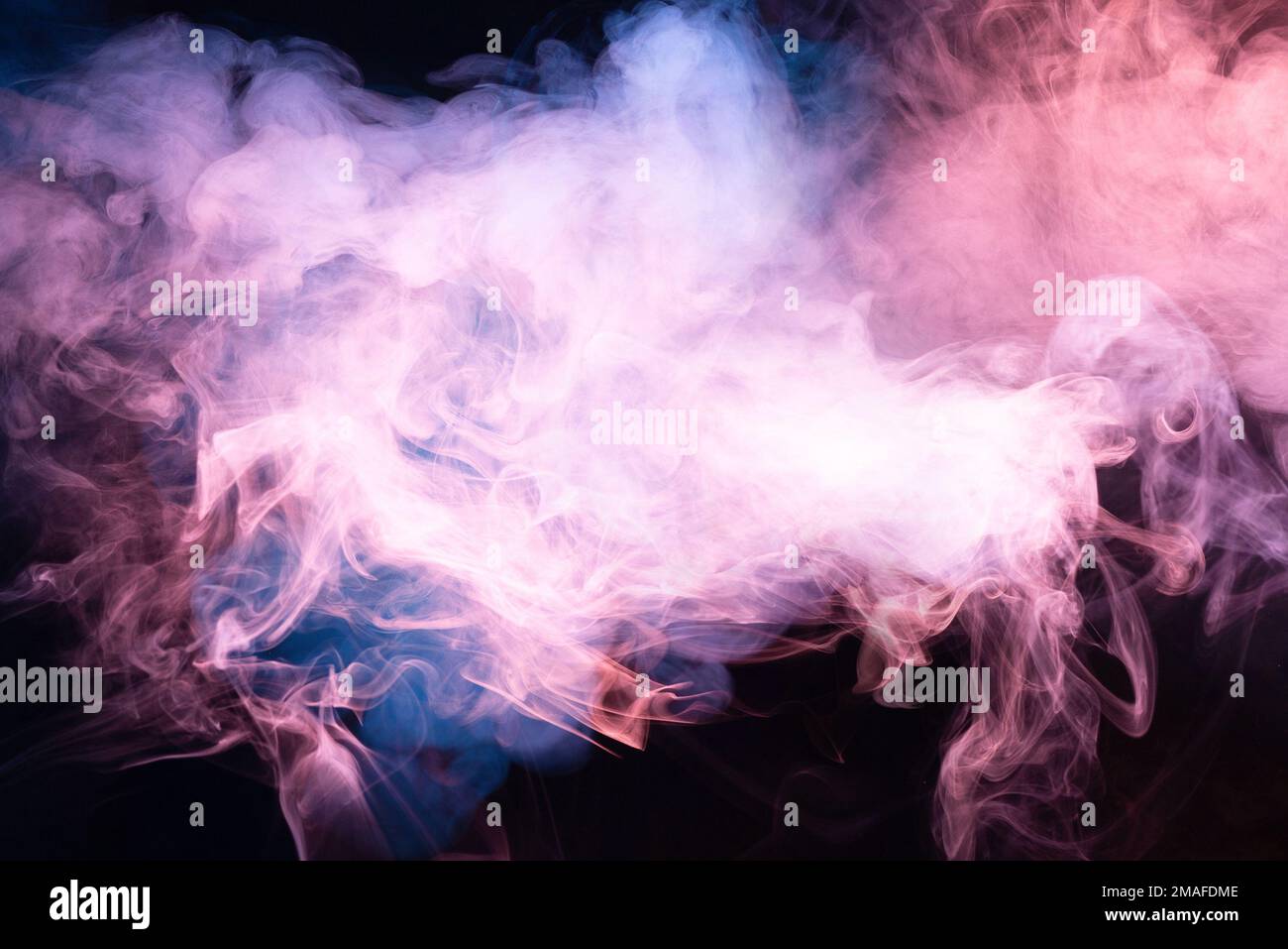 Blue and pink steam on a black background. Copy space Stock Photo - Alamy