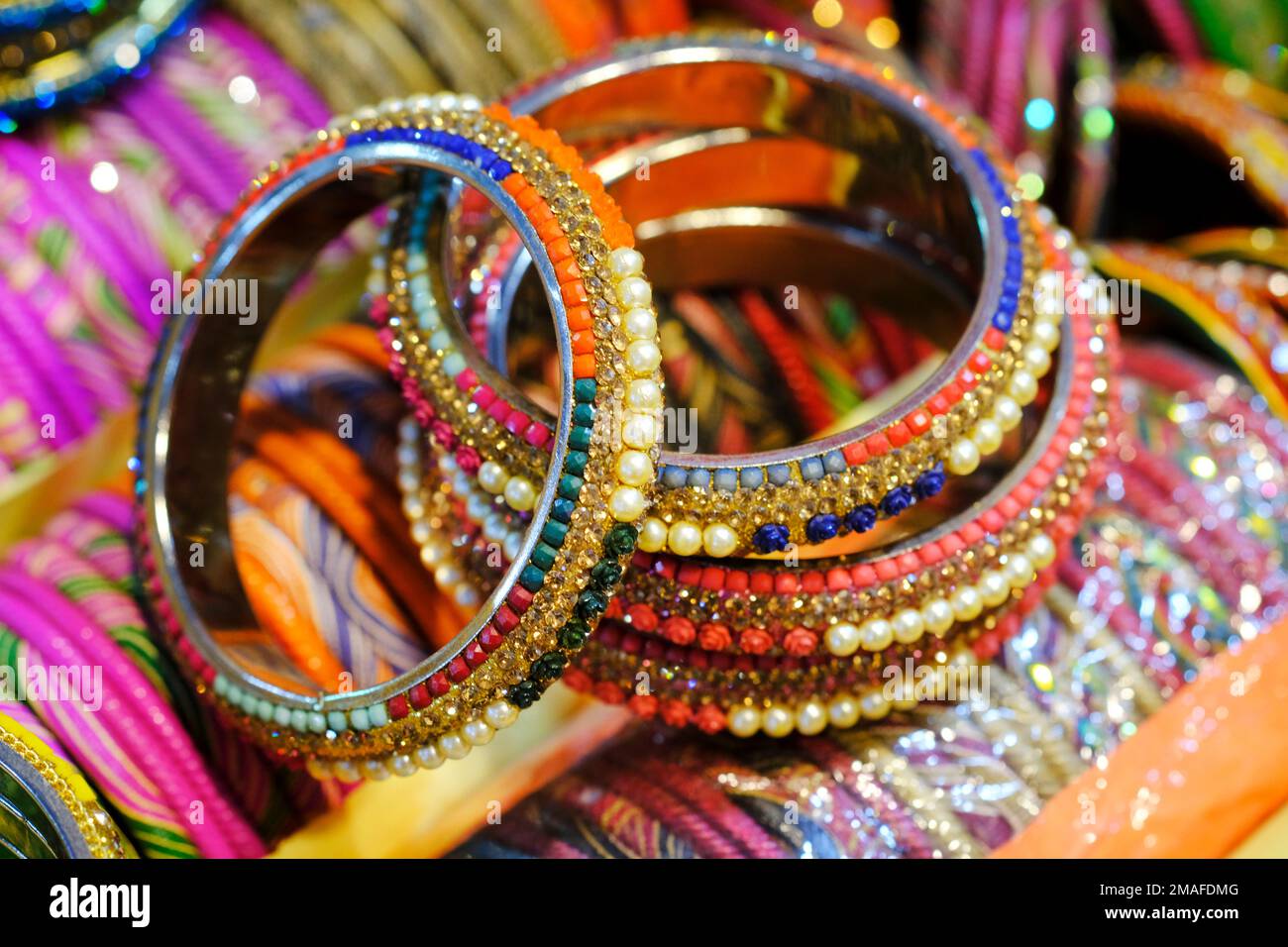 Indian Gold bangles displayed in local shop in a market of Pune, India ...