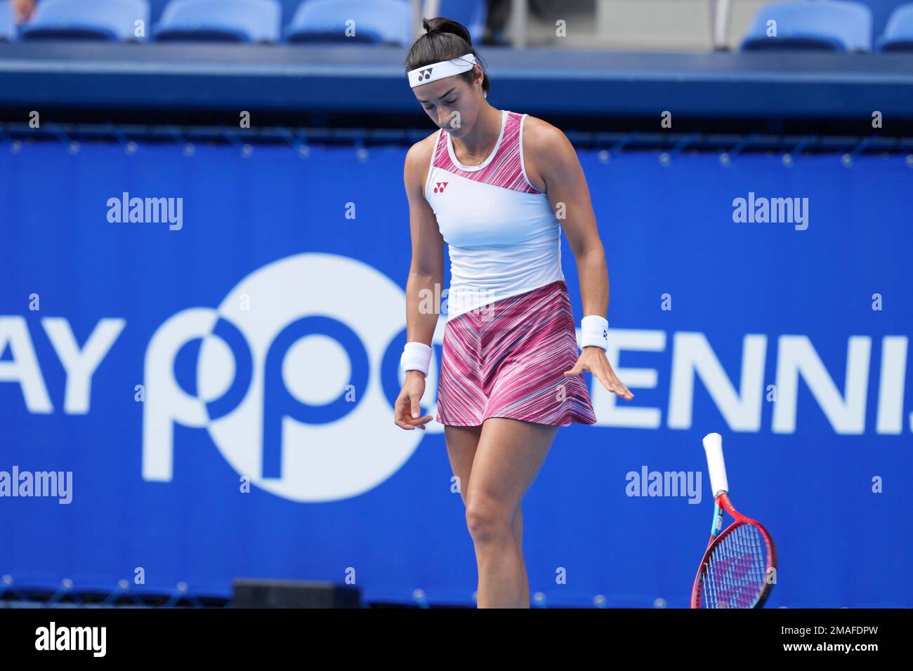 Caroline Garcia of France throws her racquet as she missed a point ...
