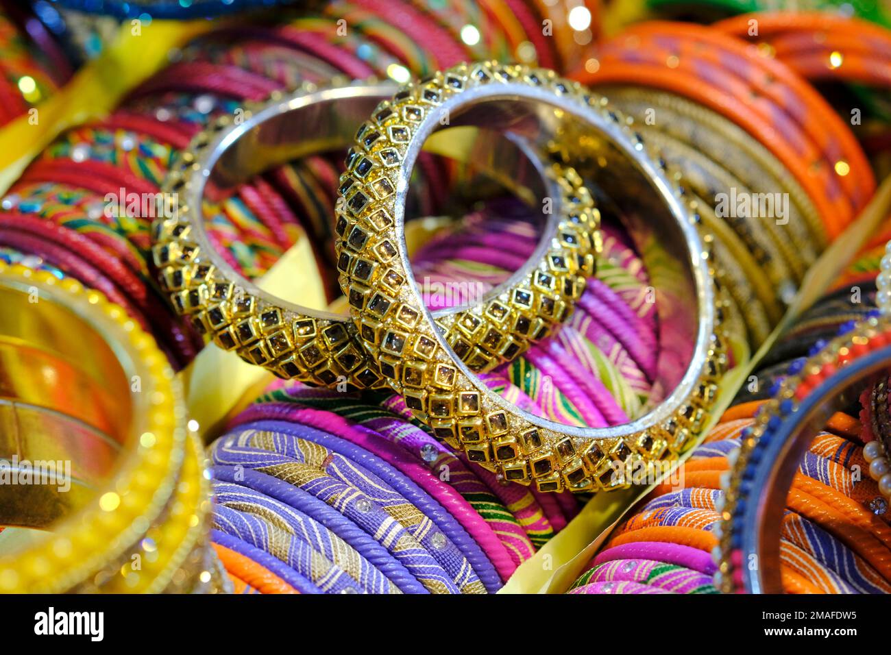 Indian Gold bangles displayed in local shop in a market of Pune, India ...