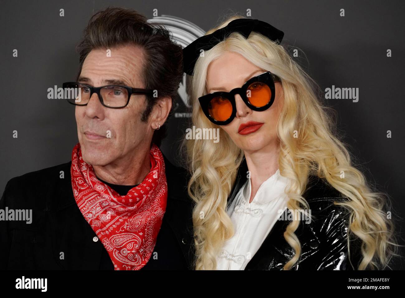 Slim Jim Phantom, left, and Jennie Vee pose together at the premiere of ...