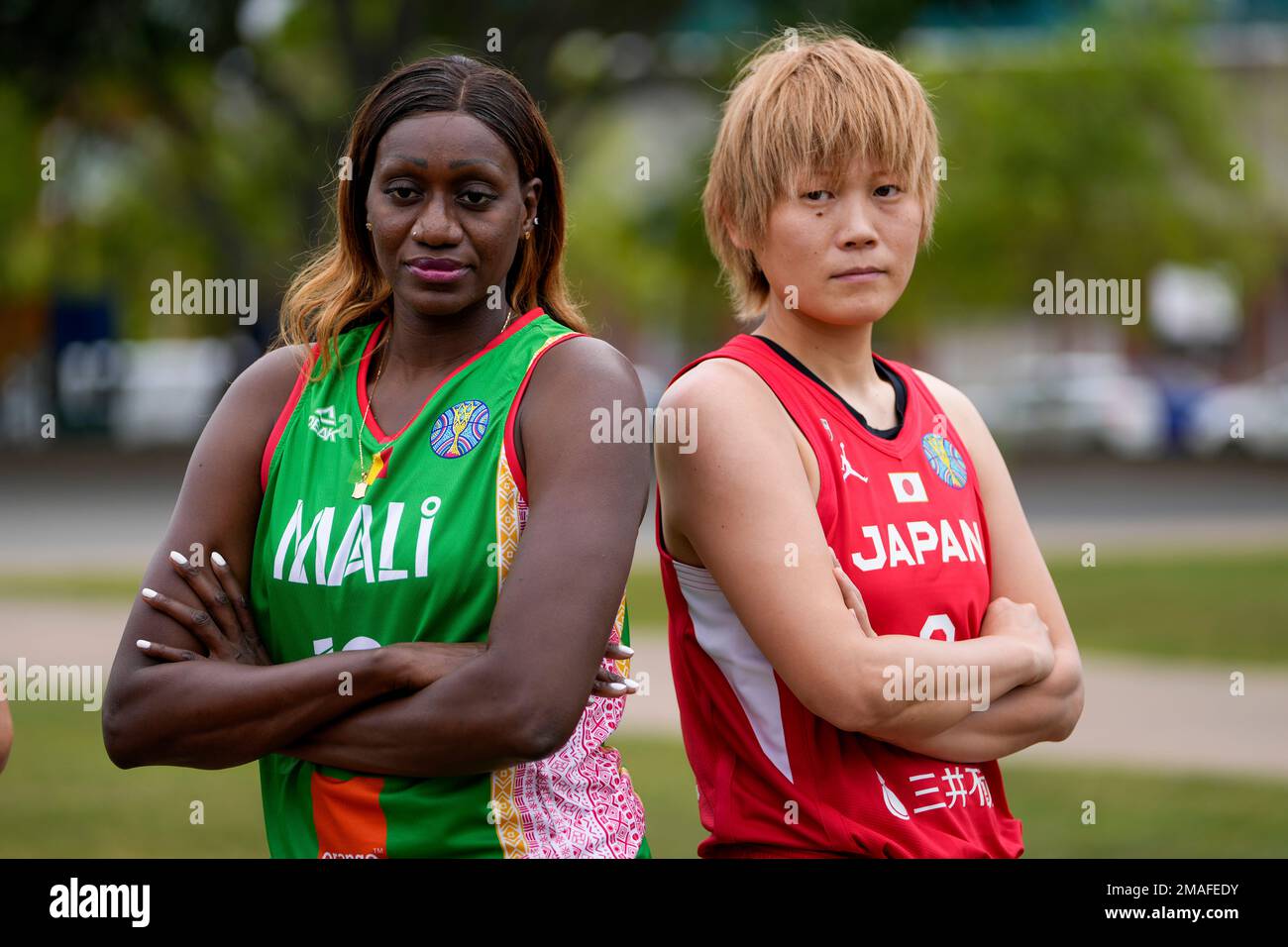 Rival captain's, Mali's Meiya Tirera, and Japan's Maki Takada pose for ...