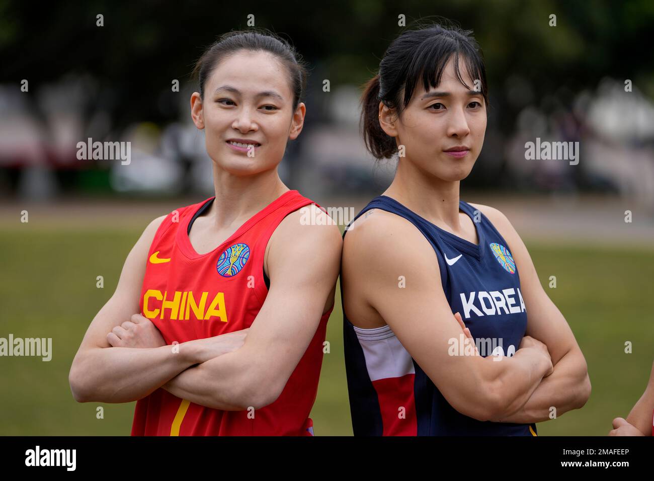 Rival captain's, China's Yang Liwei, left, and South Korea's Kim Danbi pose for a photo ahead of ...
