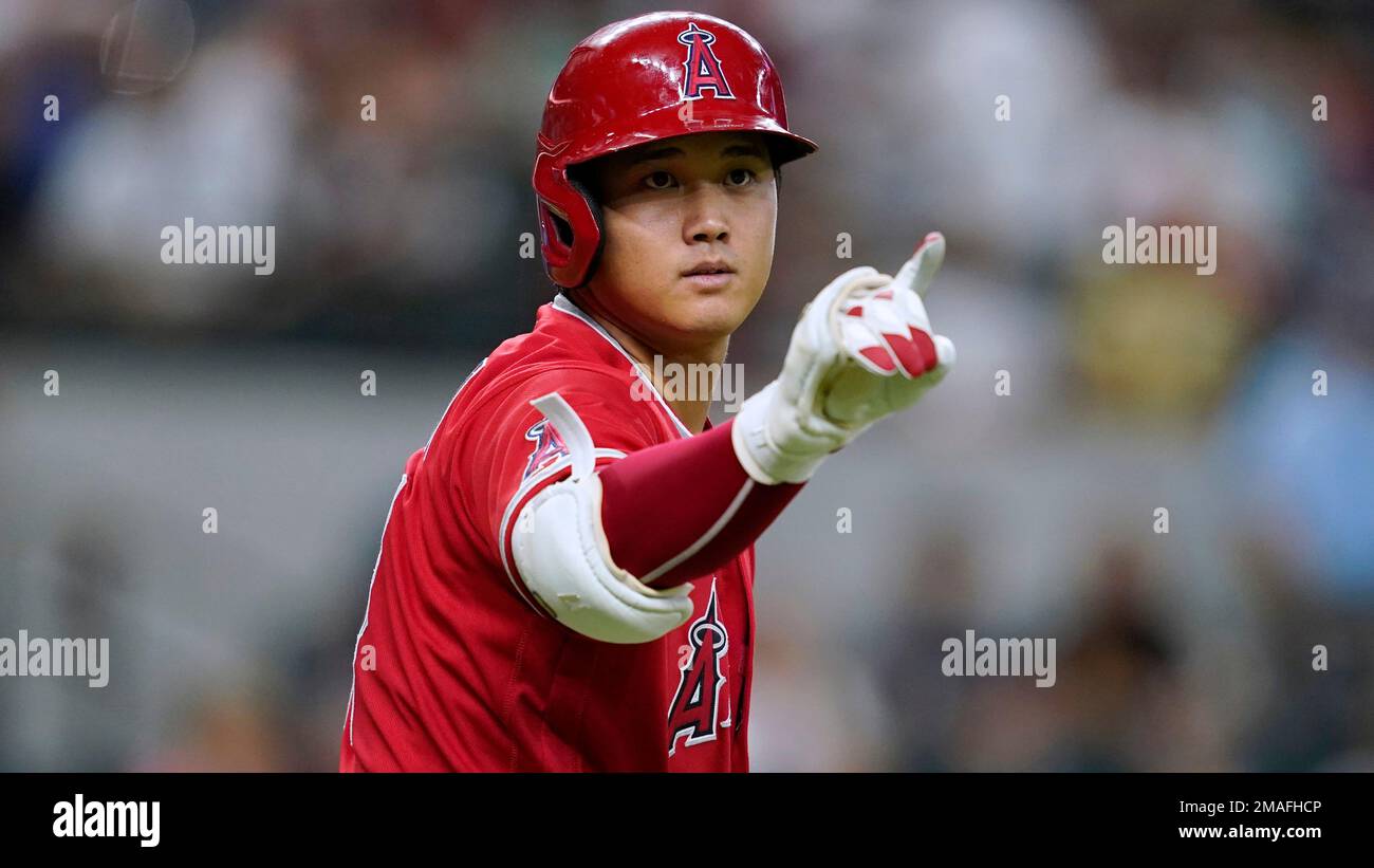 Los Angeles Angels' Shohei Ohtani waves to the Texas Rangers' dugout ...