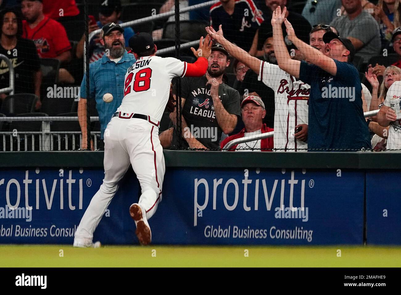 Atlanta Braves first baseman Matt Olson (28) can't catch a foul by hit ...