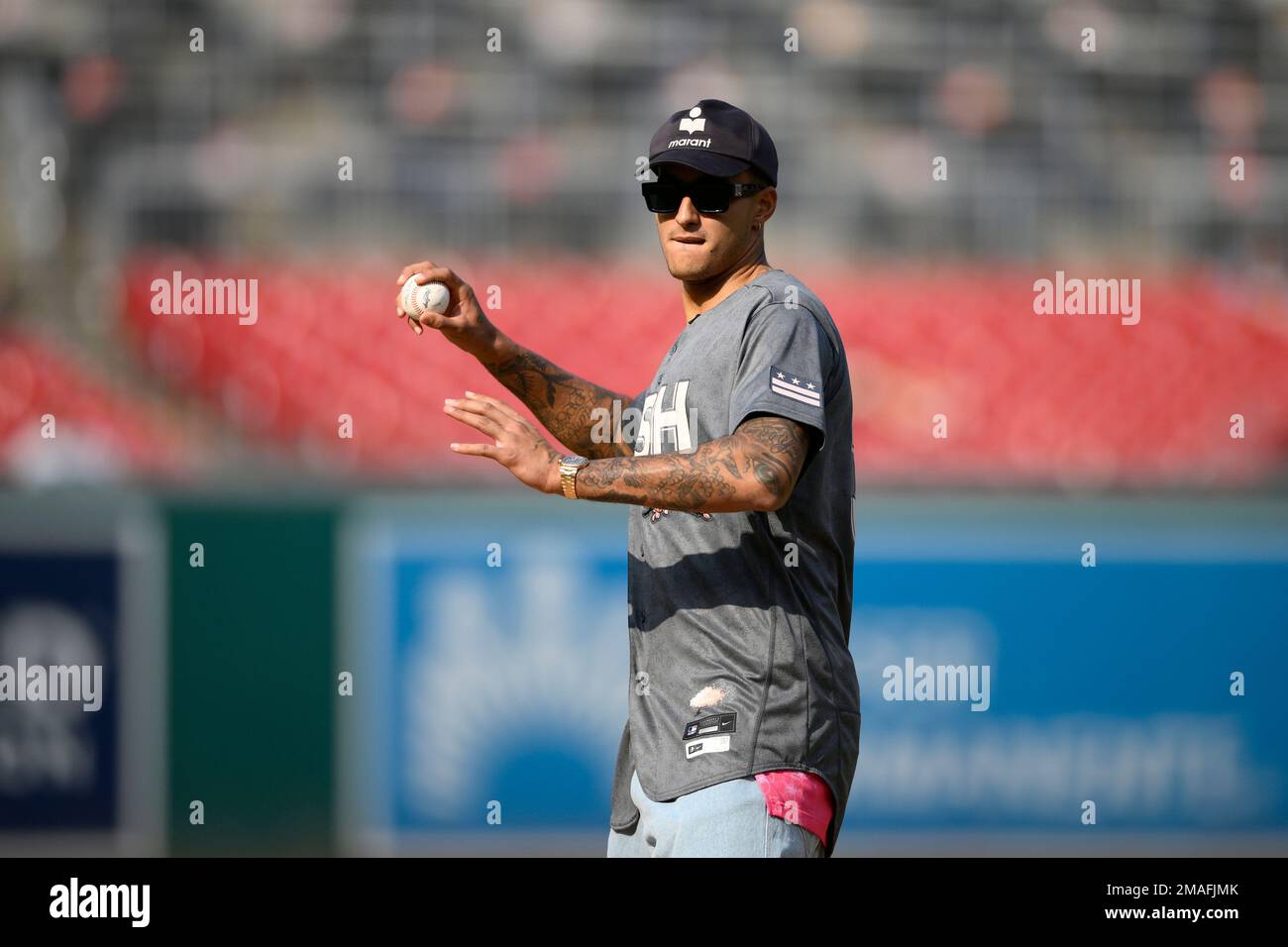 Washington Wizards basketball player Kyle Kuzma throws out the ...