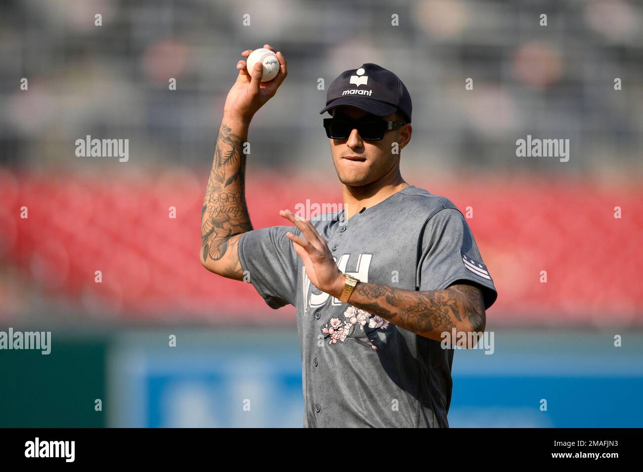 Washington Wizards basketball player Kyle Kuzma throws out the ...