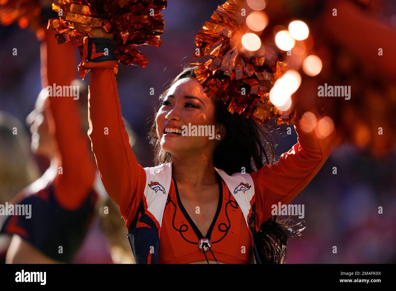 Denver Broncos cheerleader performs during an NFL football game Sunday ...