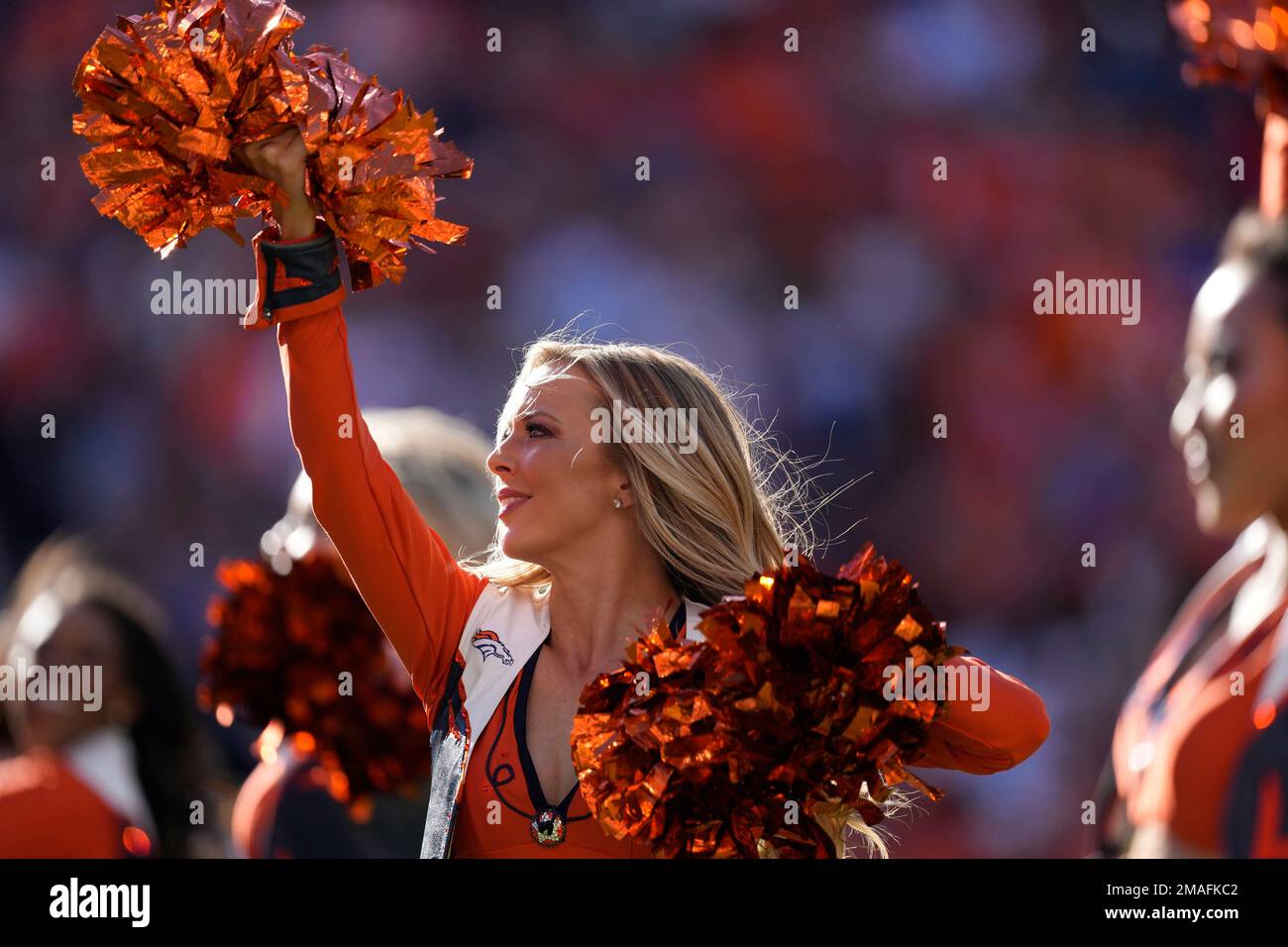 Denver Broncos cheerleader performs during an NFL football game Sunday ...