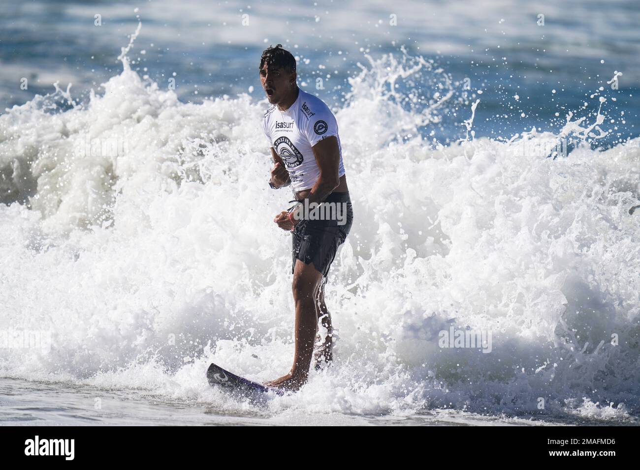 Samuel Pupo, of Brazil, reacts while competing in the ISA World Surfing ...
