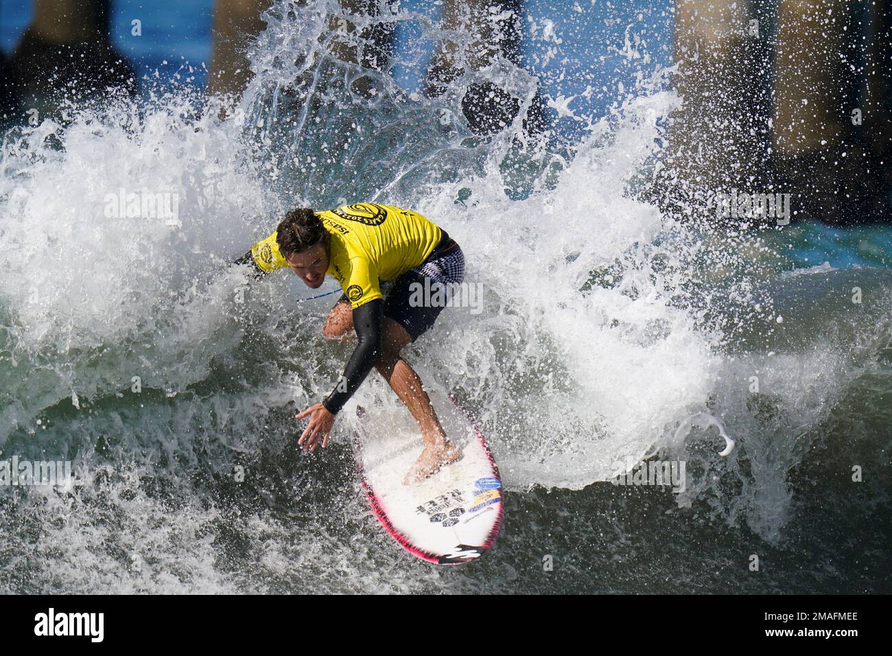 Joshua Burke, of Barbados, competes during the ISA World Surfing Games ...