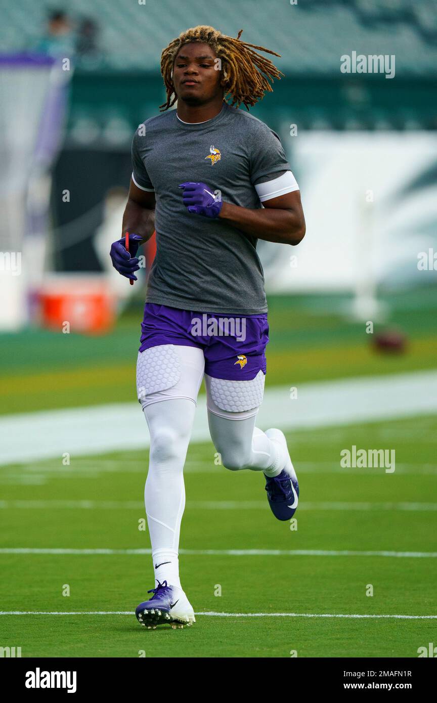 Minnesota Vikings safety Lewis Cine (6) warms up prior to the NFL ...
