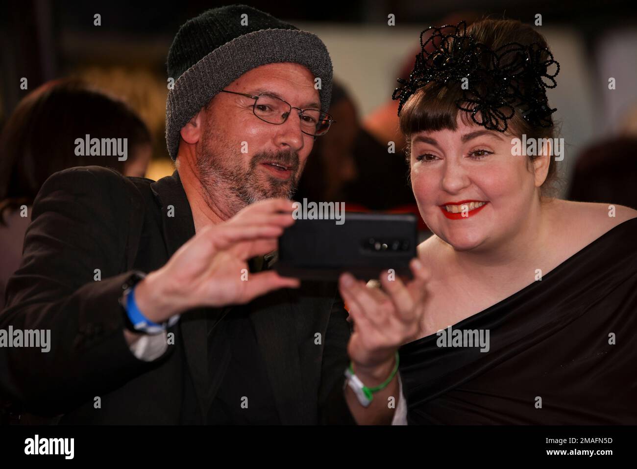 Director Lena Dunham, right, poses for selfies upon arrival for the UK ...
