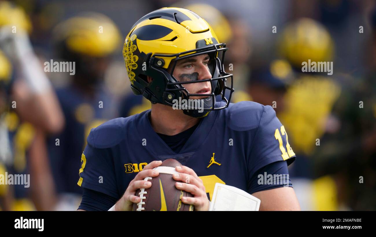 Michigan quarterback Cade McNamara warms up before an NCAA college football game against ...