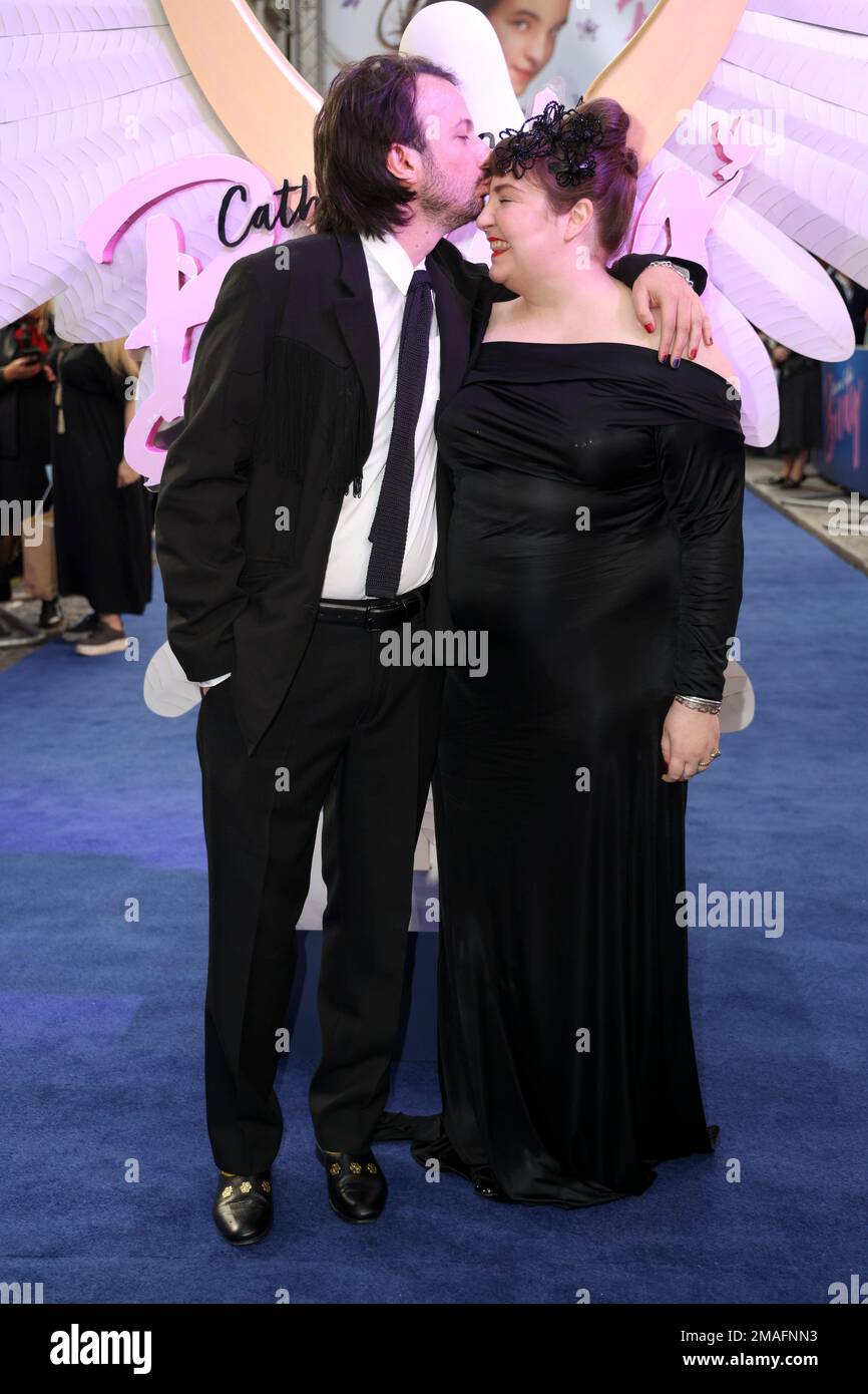Luis Felber, left, and Lena Dunham pose for photographers upon arrival ...