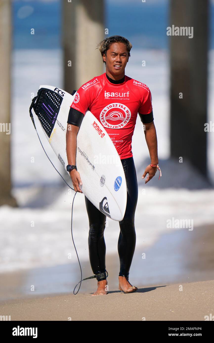 Keanu Kamiyama, of Japan, walks on the sand after competing in the ISA ...