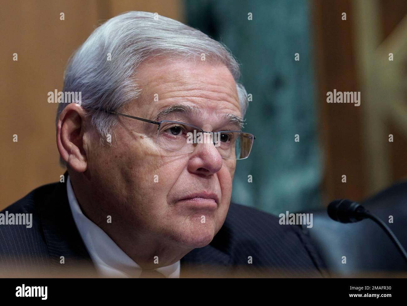 Sen. Bob Menendez, D-N.J., listens during a Senate Banking, Housing ...