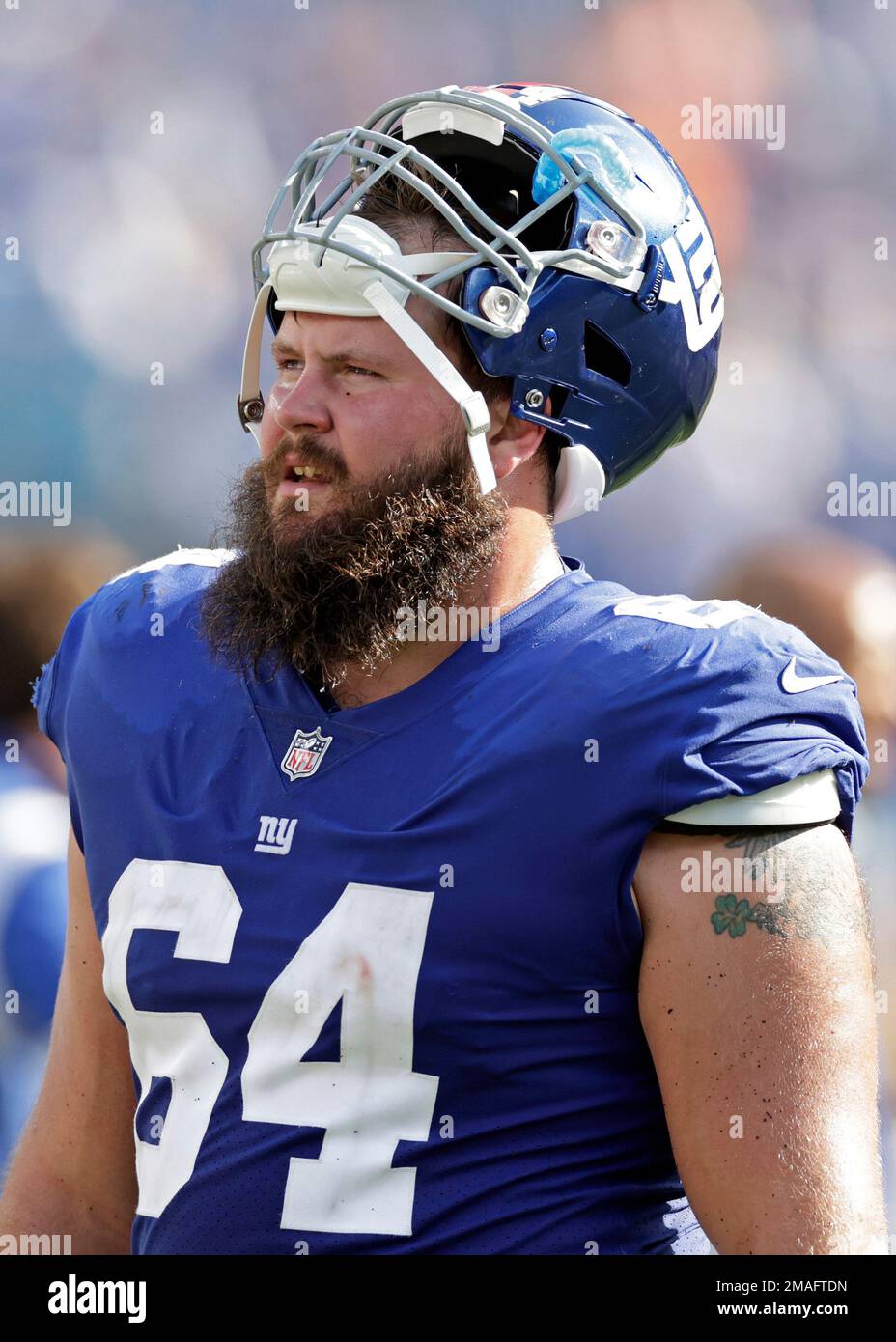 New York Giants guard Mark Glowinski (64) walks off the field after an ...