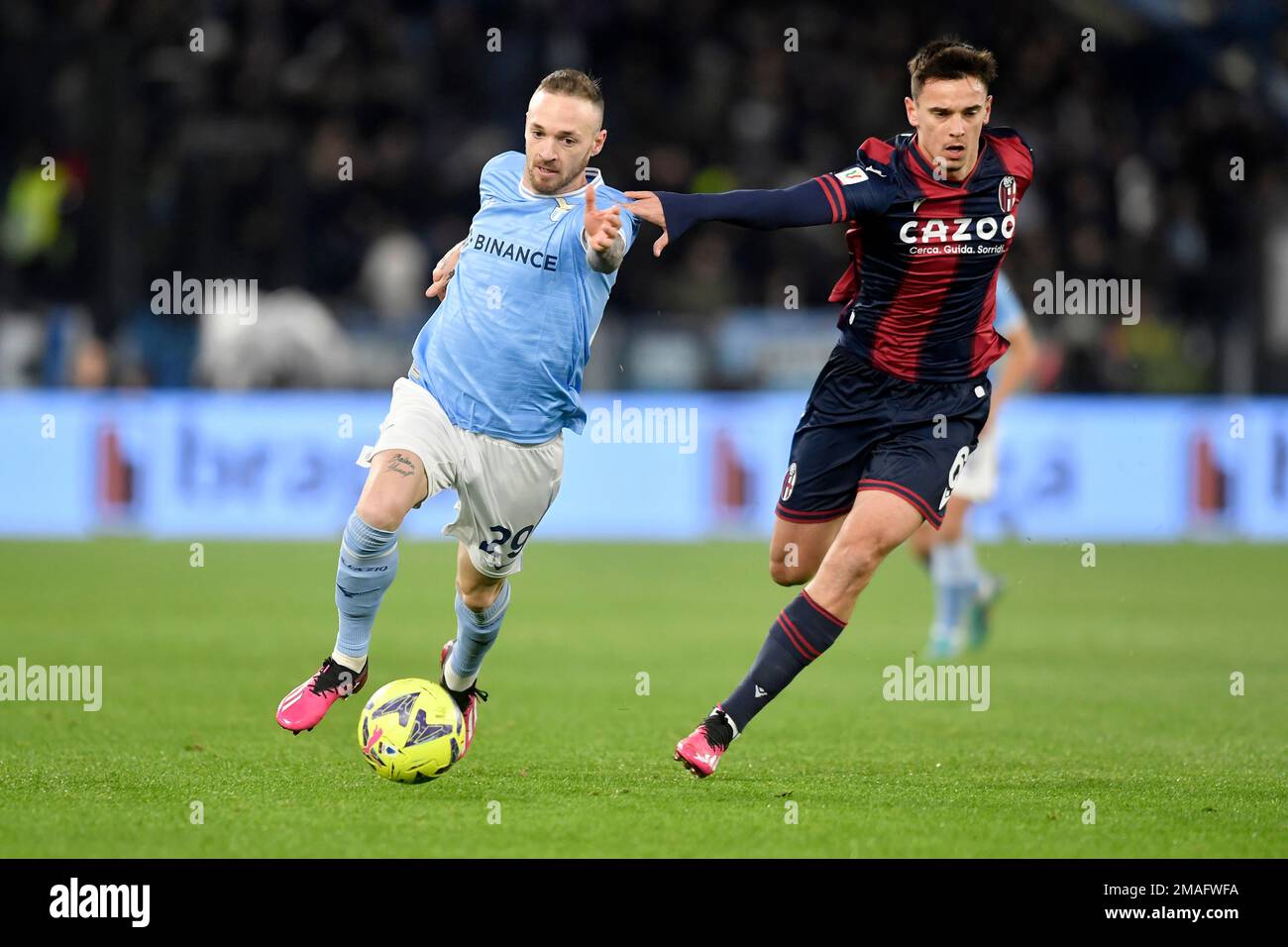 Roma, Italy. 19th Jan, 2023. Manuel Lazzari of SS Lazio and Nikola Moro of Bologna FC during the ...