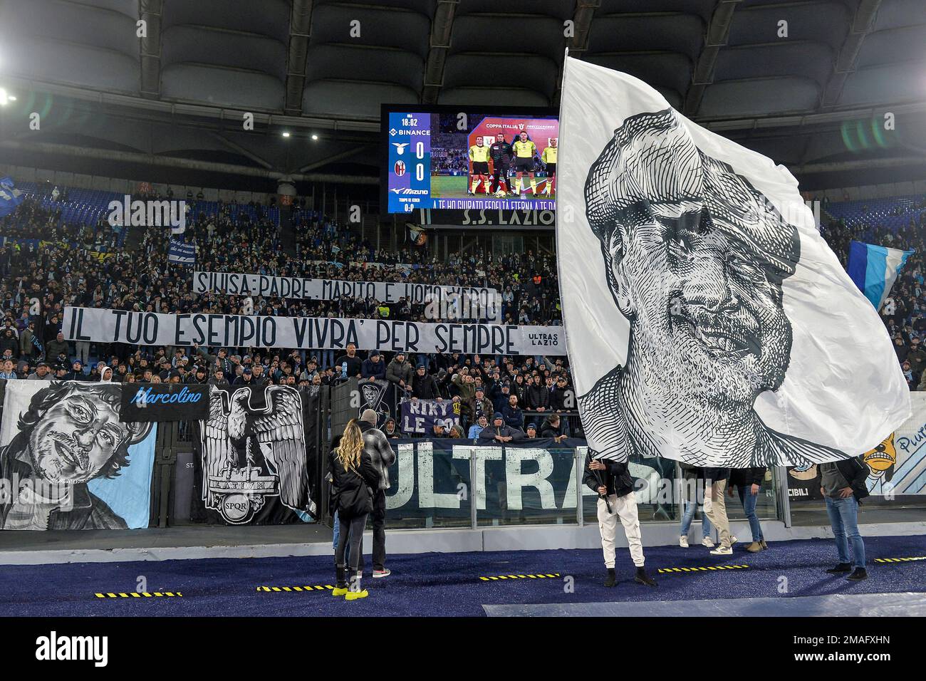 Roma, Italy. 19th Jan, 2023. Lazio fans wave a flag depictung Sinisa ...