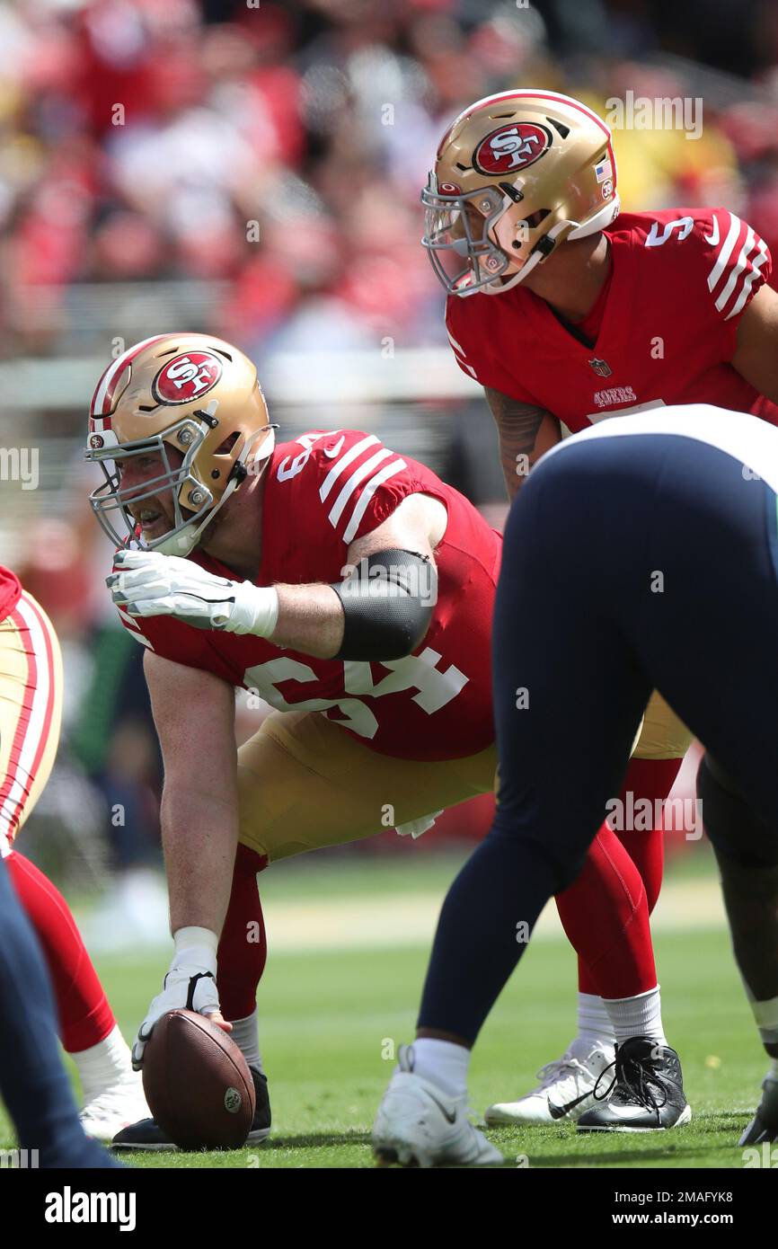 San Francisco 49ers center Jake Brendel (64) hikes the ball during an ...