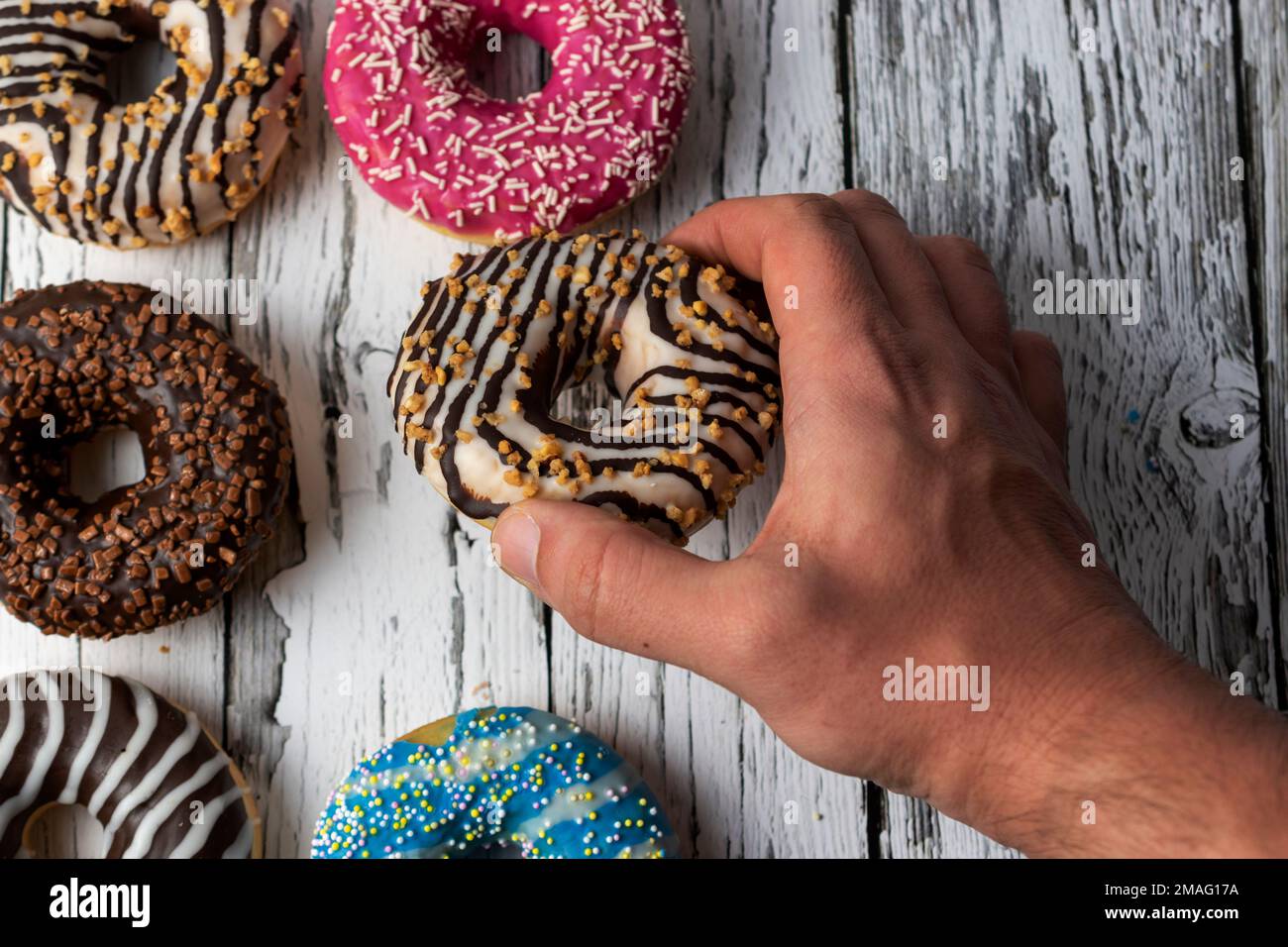 Pick up doughnut Stock Photo - Alamy