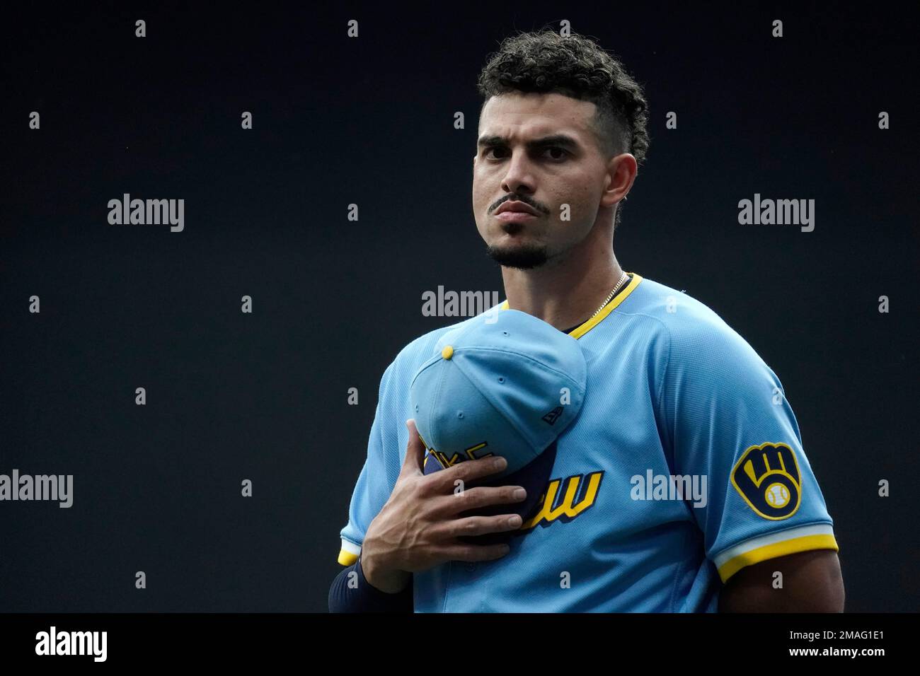 Milwaukee Brewers' Willy Adames stands for the National Anthem before a ...
