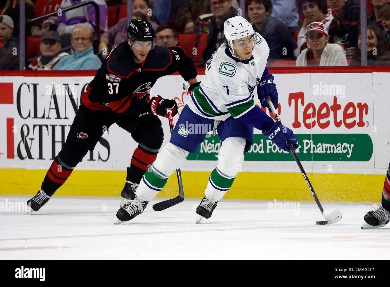 Vancouver Canucks' William Lockwood (7) controls the puck in front of ...