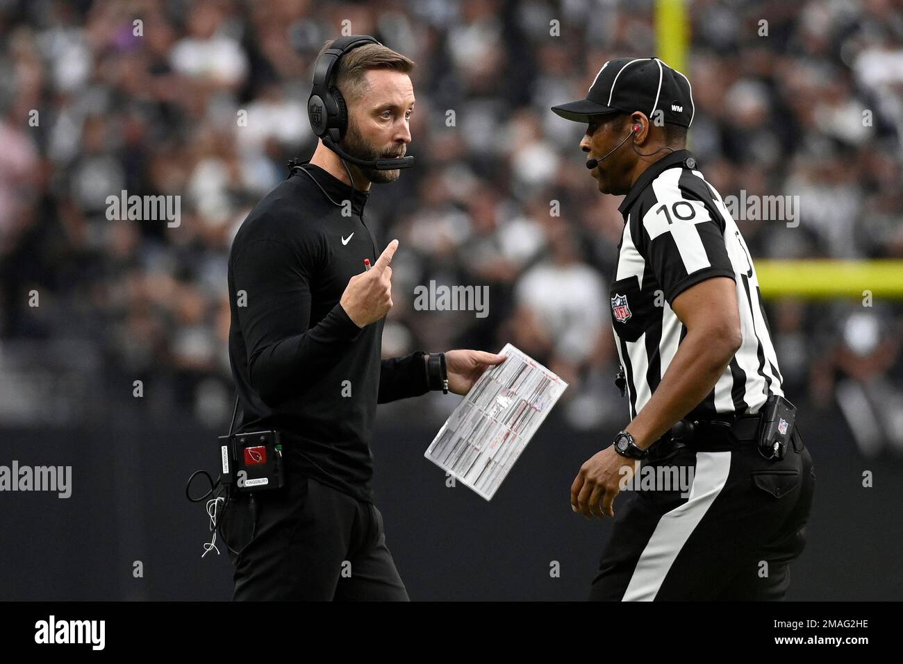 Arizona Cardinals head coach Kliff Kingsbury, left, speaks with line ...