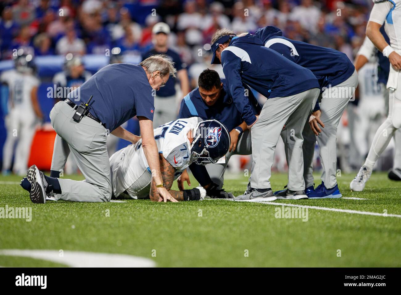 Tennessee Titans offensive tackle Taylor Lewan (77) is surrounded by ...