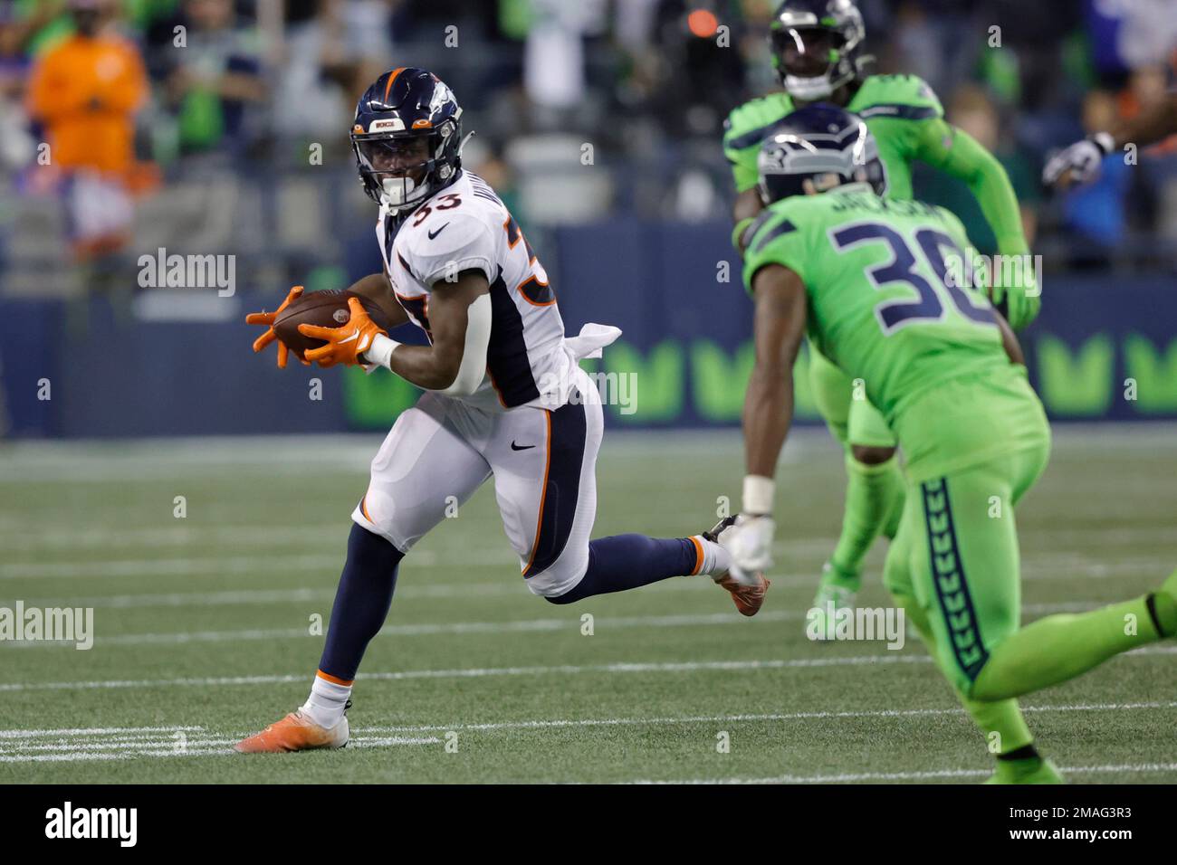 Denver Broncos running back Javonte Williams runs with the ball with ...