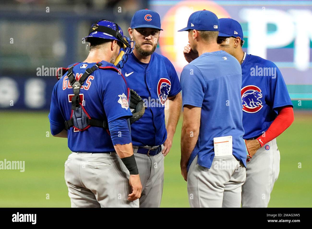 Chicago Cubs starting pitcher Wade Miley, second from left, stands on ...