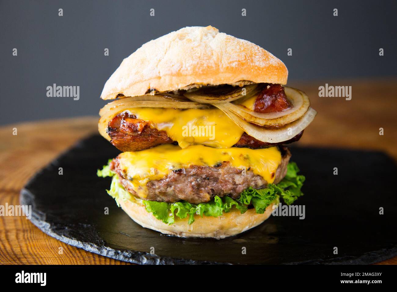 Premium Authentic American Burger with a tender pork rib on top Stock ...