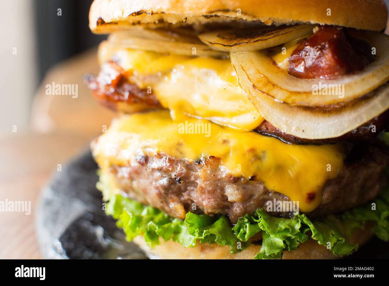 Premium Authentic American Burger with a tender pork rib on top Stock ...