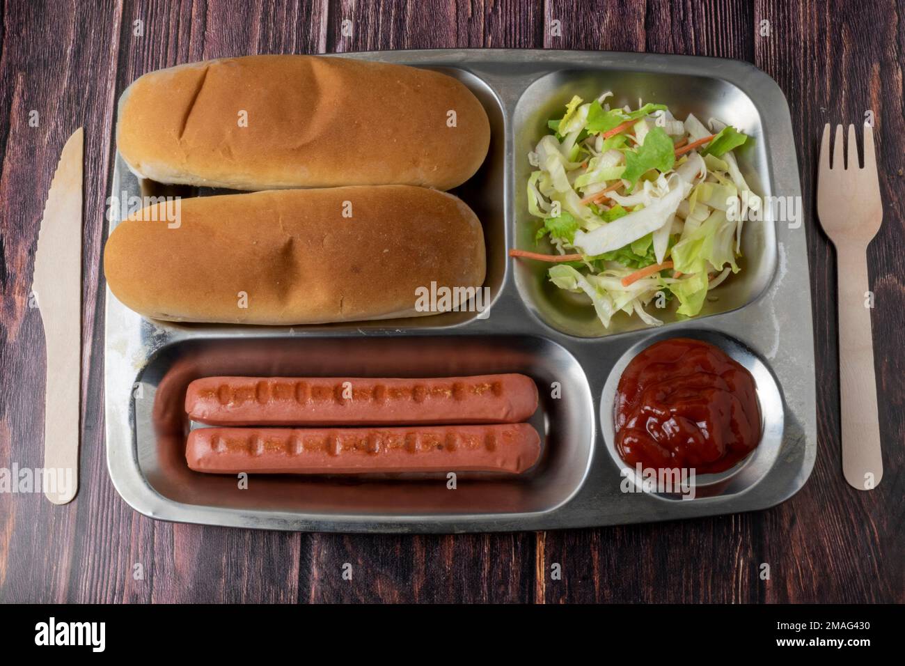Sausage on metal plate Stock Photo - Alamy