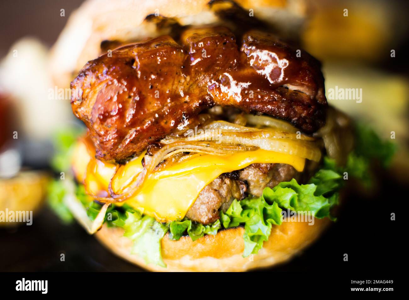 Premium Authentic American Burger with a tender pork rib on top Stock ...