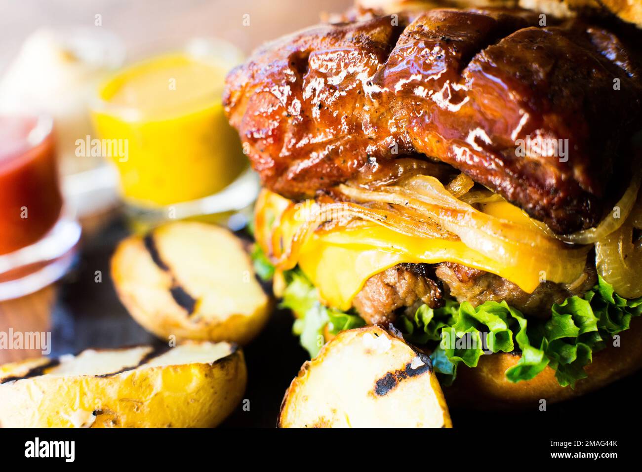 Premium Authentic American Burger with a tender pork rib on top Stock ...