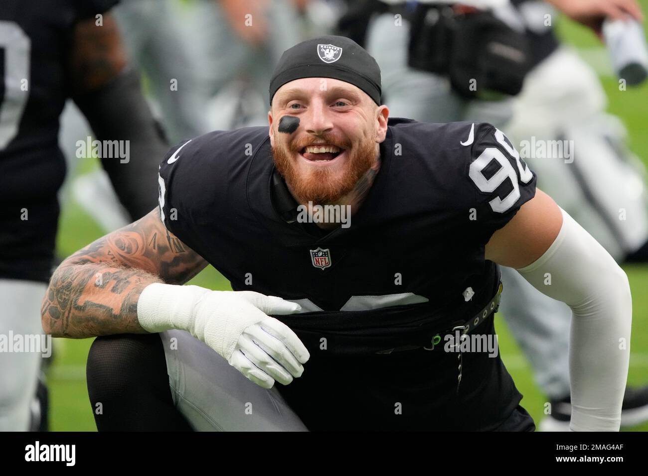 Las Vegas Raiders defensive end Maxx Crosby (98) warms up before an NFL ...