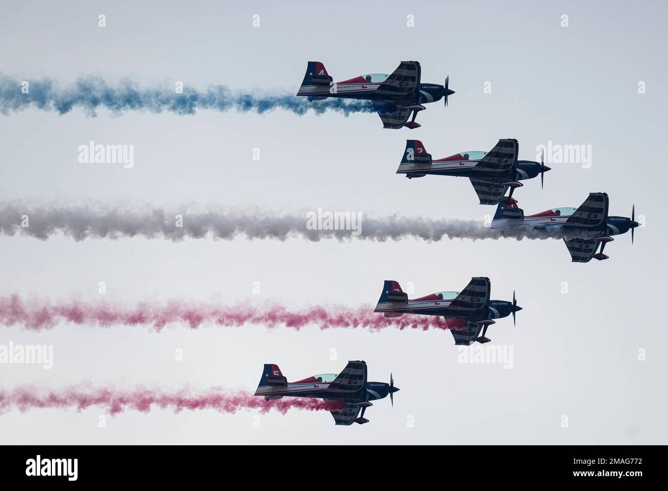 A Chilean Air Force aerobatic team does a flyby during a military ...