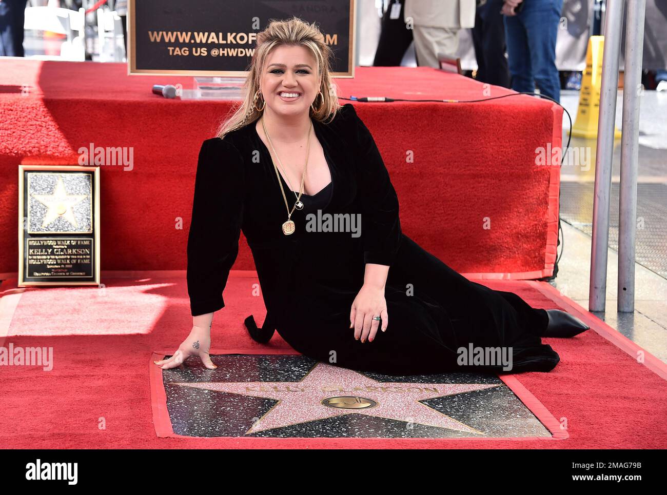 Singer and talk show host Kelly Clarkson poses atop her new star on the ...