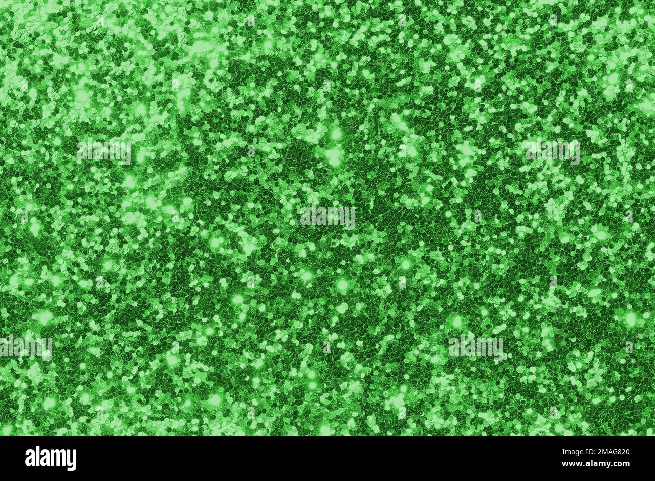 GREEN shimmering glitter material background with glowing effects and ...