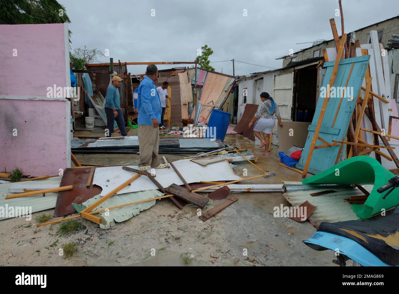 Residents stand amid their homes that were damaged by Hurricane Fiona ...
